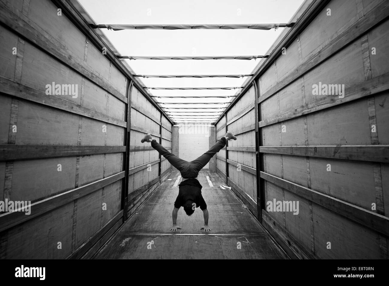 Hand stand walking Black and White Stock Photos & Images - Alamy