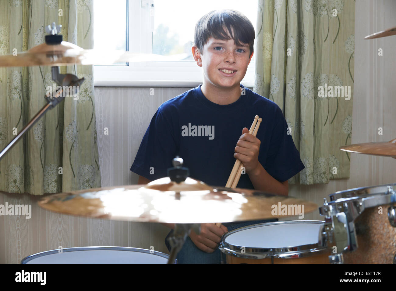 Boy Playing Drum Kit At Home Stock Photo - Alamy