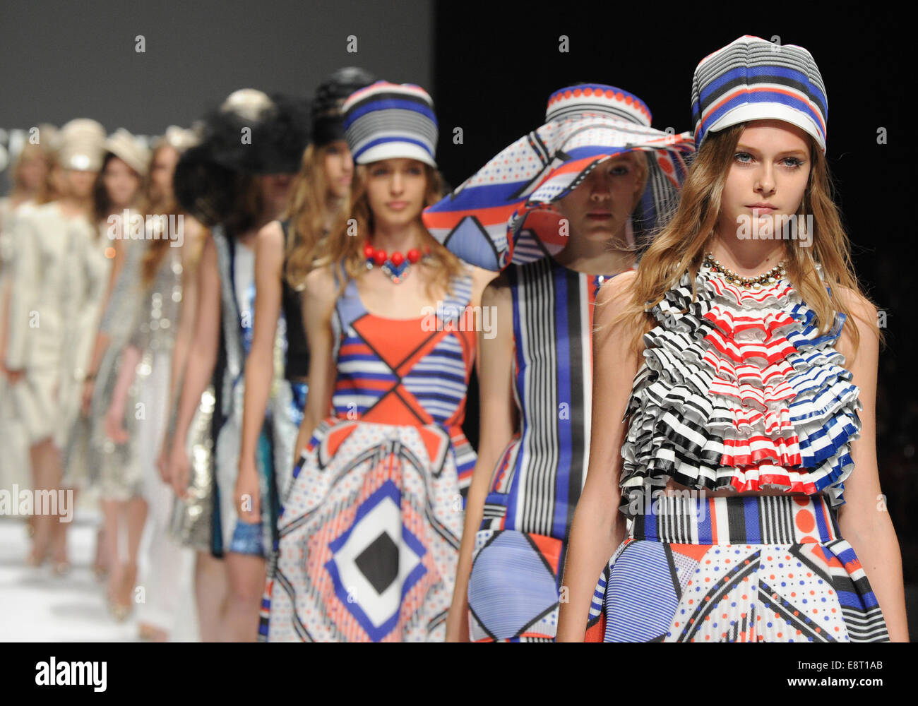 Tokyo, Japan. 14th Oct, 2014. Models display creations designed by ...