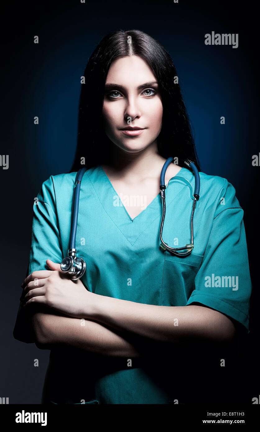 attractive doctor in dark blue light Stock Photo - Alamy