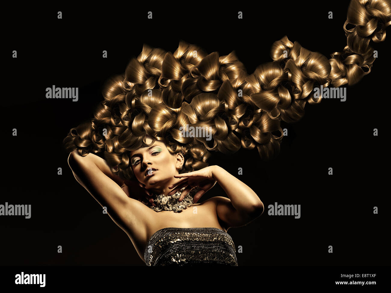 Attractive woman with long gold hair Stock Photo - Alamy