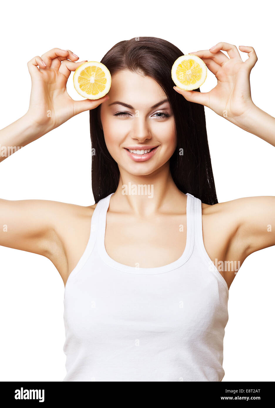 cute girl with two lemons on white background Stock Photo - Alamy