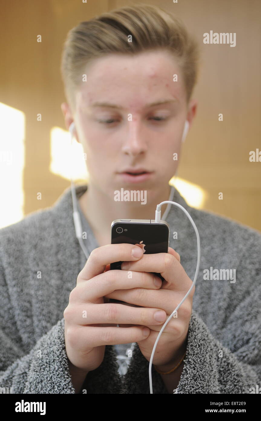 Teenage Boy Using An Apple iphone 4 Stock Photo - Alamy
