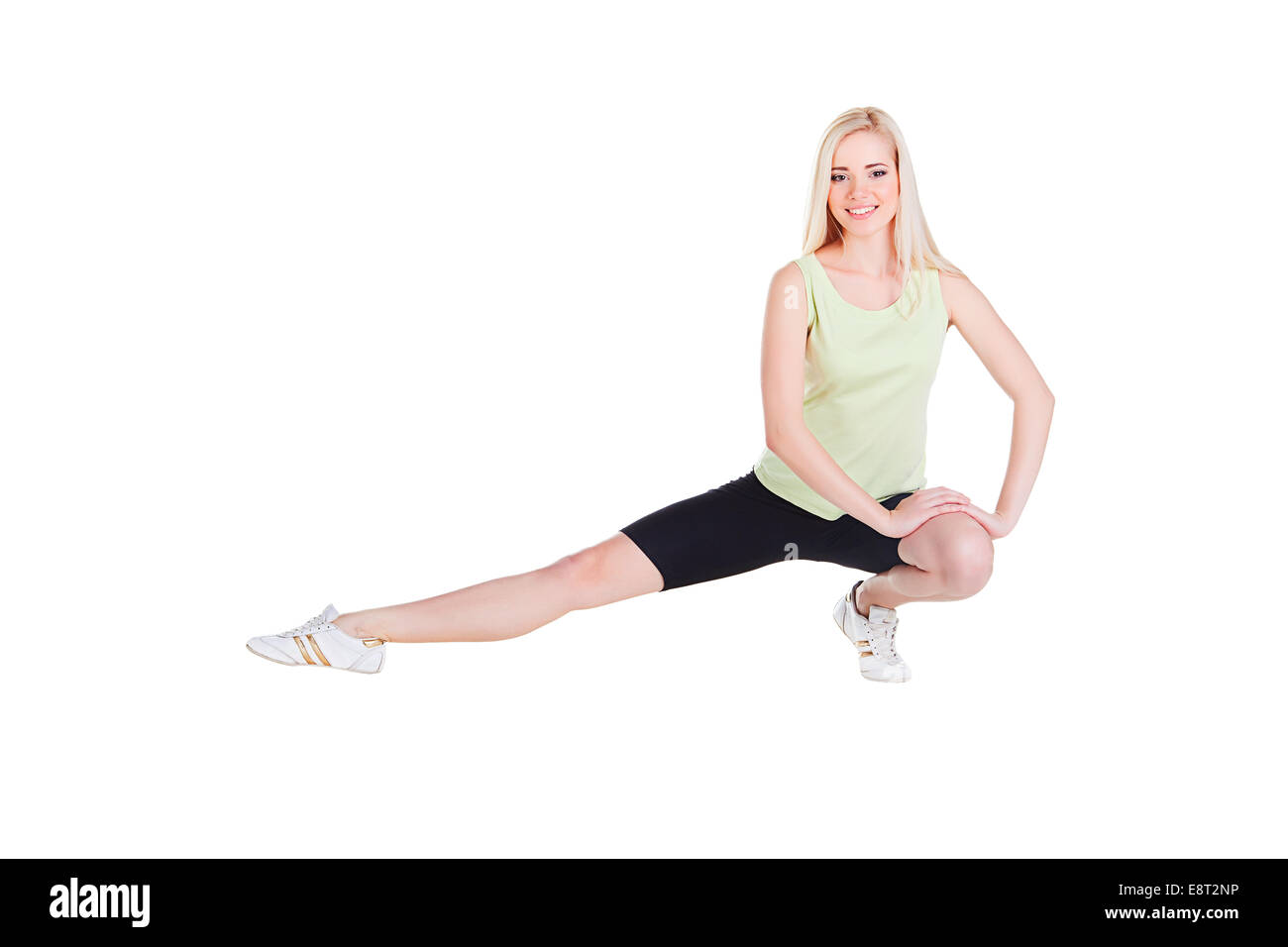 girl's exercise siting on one leg on white background Stock Photo - Alamy