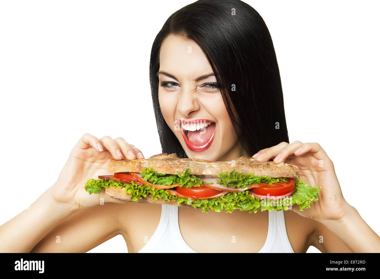 happy woman eating long sandwich on white background Stock Photo - Alamy