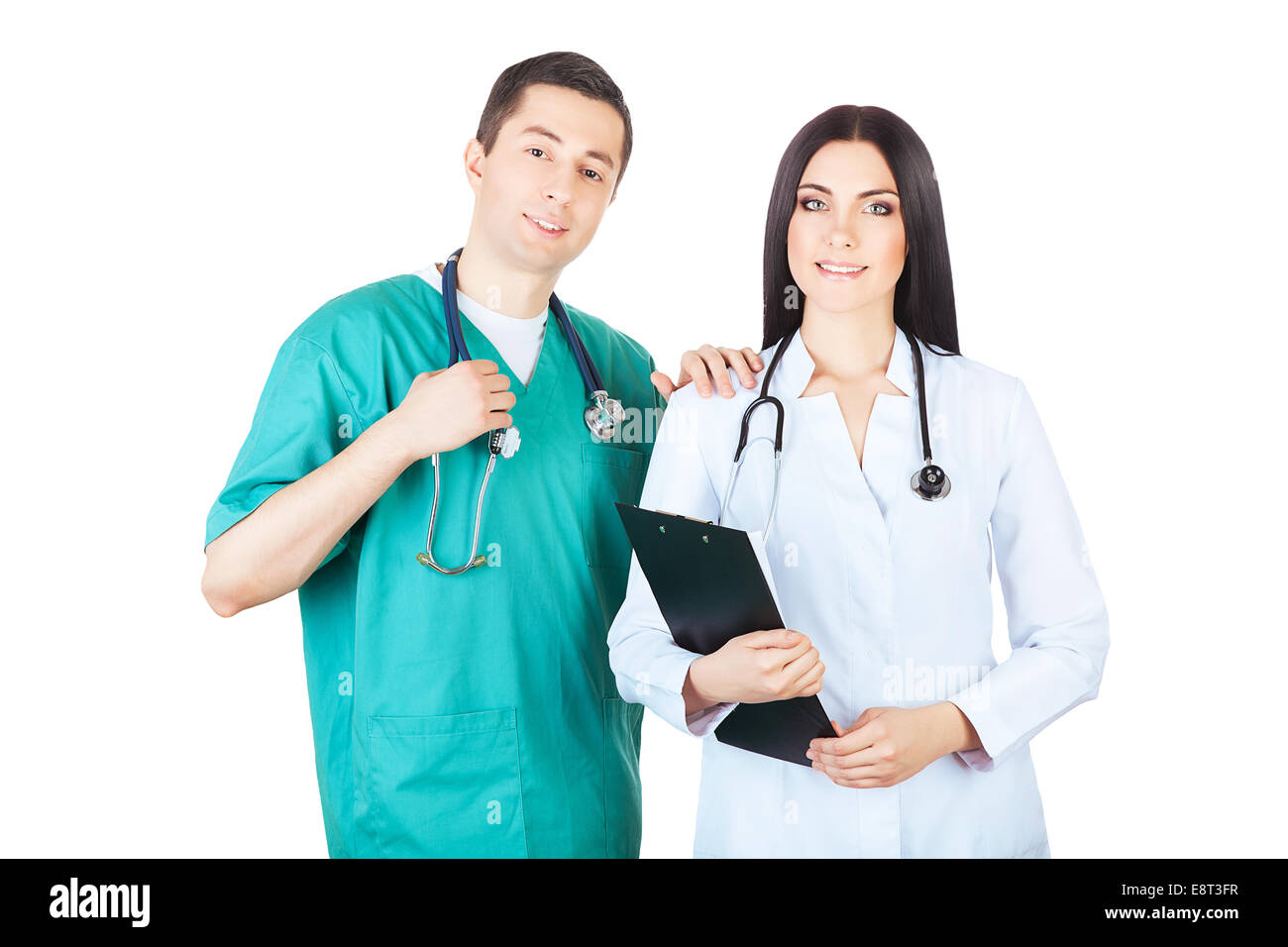 smiling doctors in uniforms on white background Stock Photo - Alamy