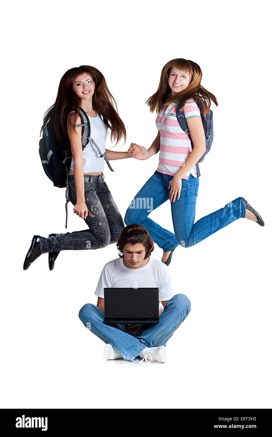 Three students with laptop on the white background Stock Photo - Alamy
