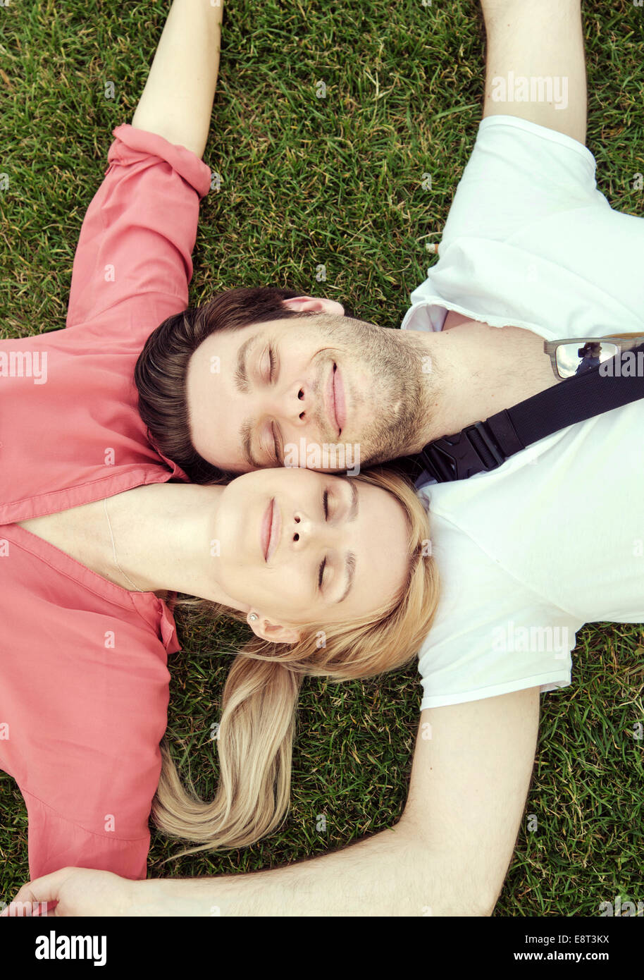 Portrait of the lying and resting couple Stock Photo - Alamy