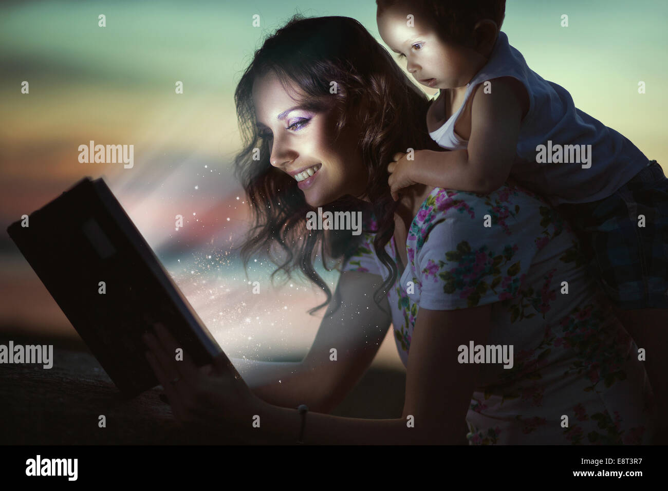 Mommy reading amazing book for her baby Stock Photo - Alamy