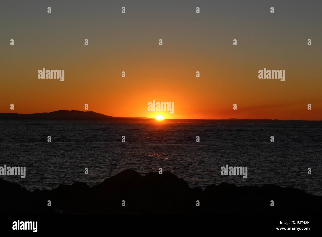 Sunset over the sea in Australia Stock Photo - Alamy