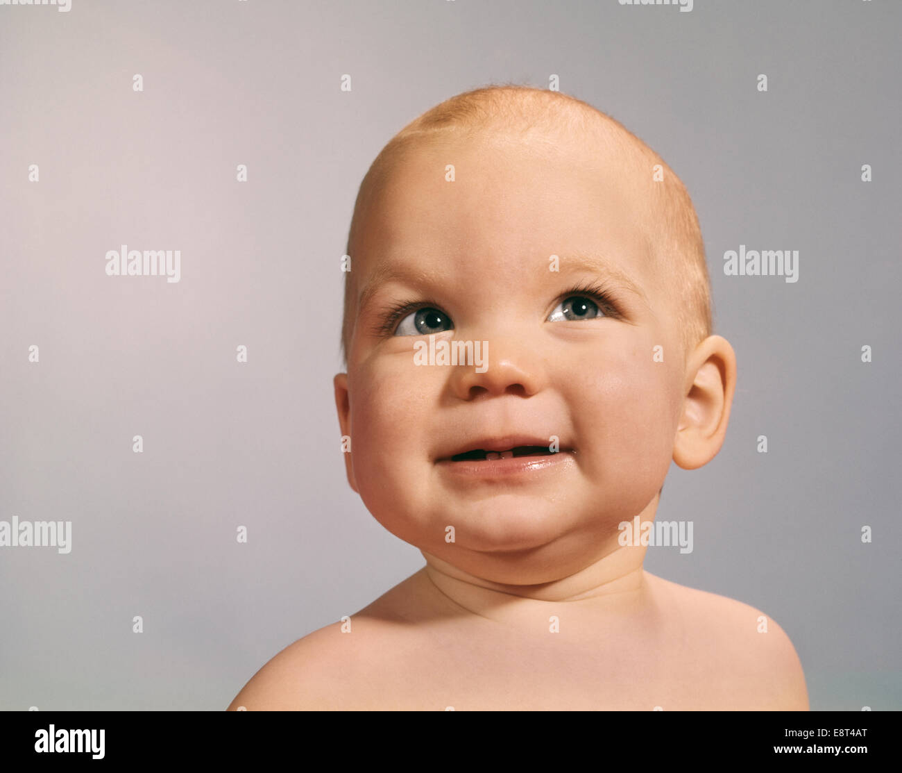 1960s 1970s BABY PORTRAIT WITH EYES LOOKING TO SIDE WITH SLY DUBIOUS ...