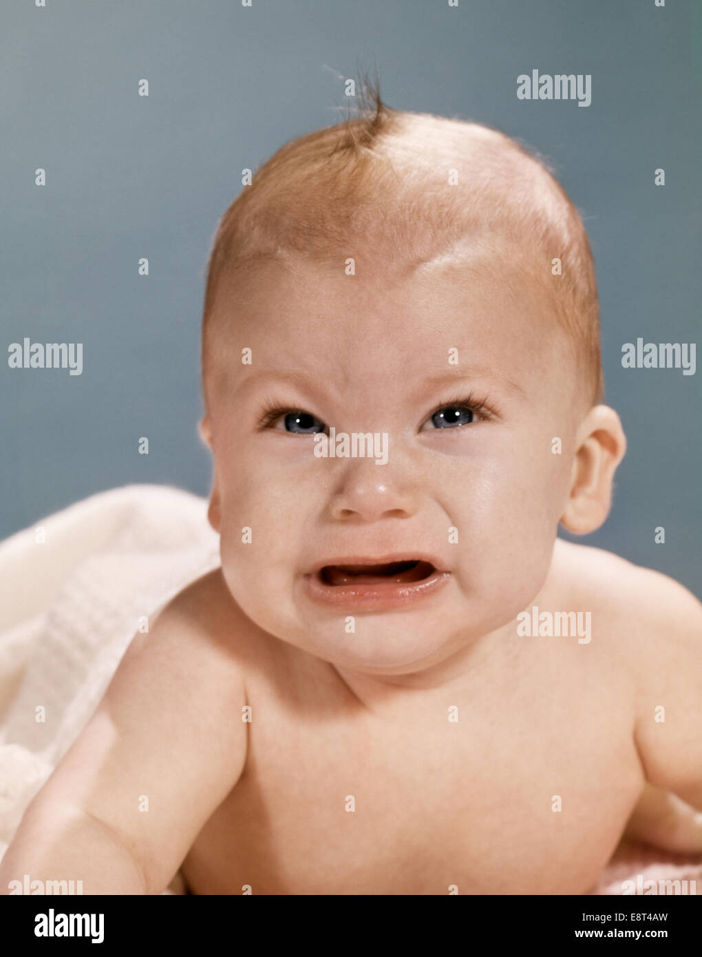 1960s CRYING BABY WITH ANGRY MEAN FACIAL EXPRESSION LOOKING AT CAMERA ...