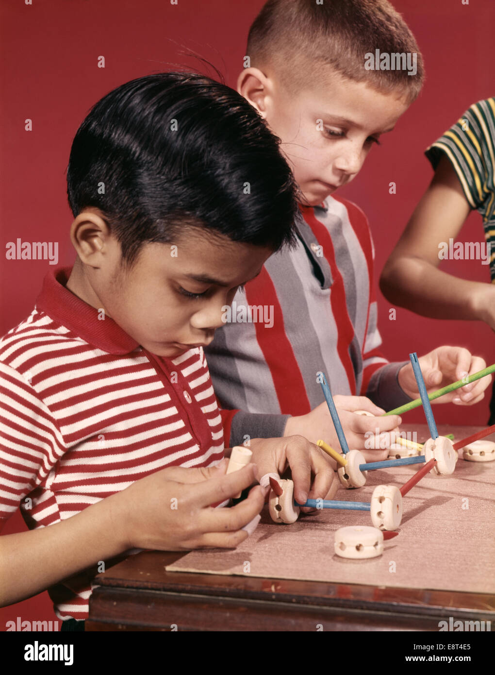 1960s 1970s HISPANIC AND CAUCASIAN BOYS PLAYING WITH TINKER TOYS Stock ...