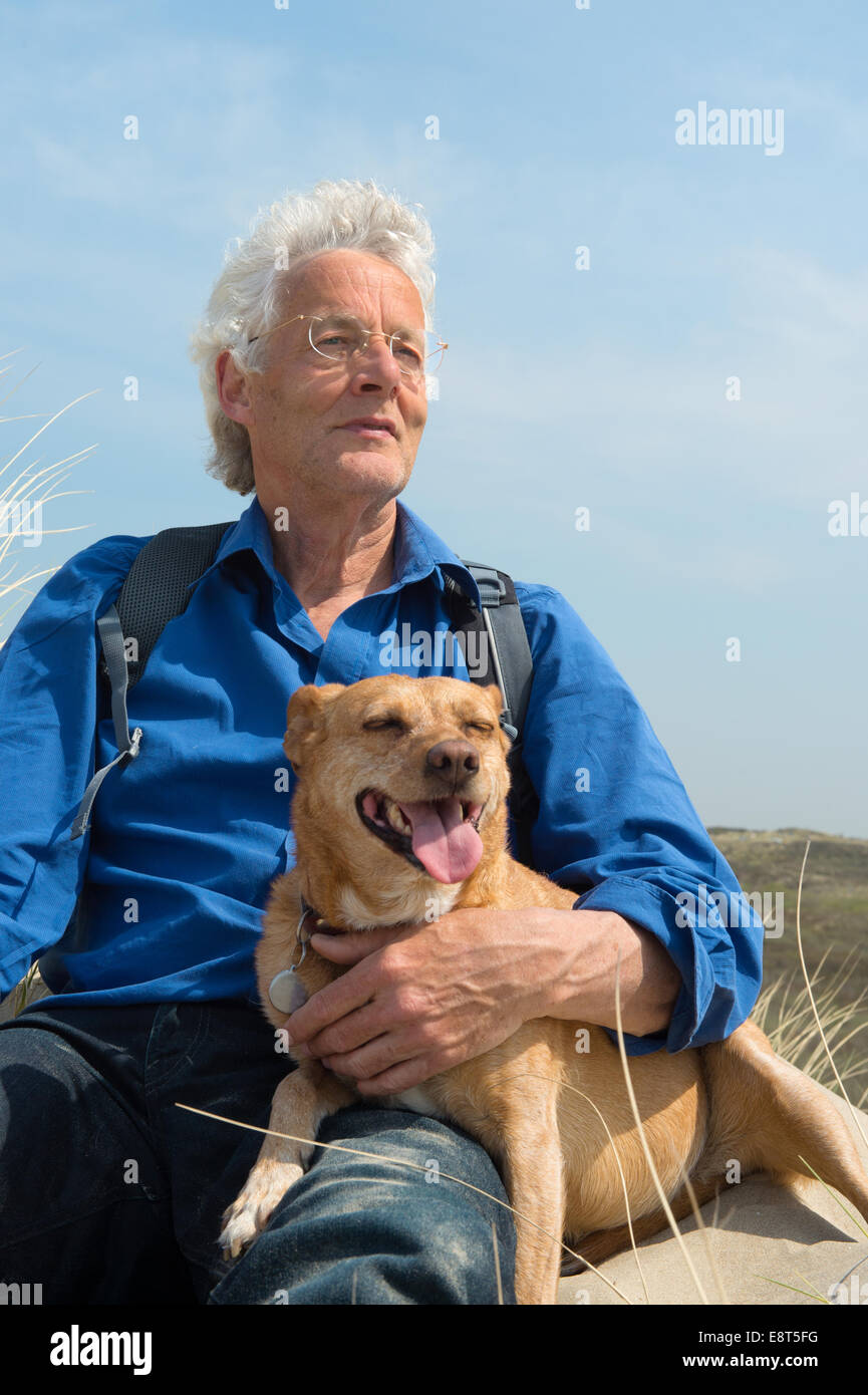 Senior man with his crossbreed brown dog hi-res stock photography and ...