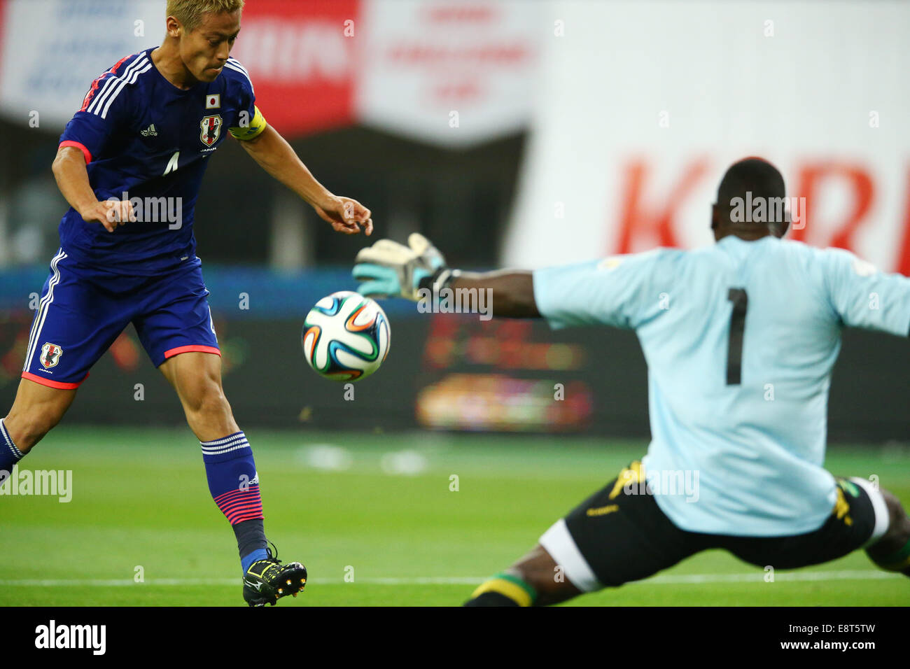 Niigata, Japan. 10th Oct, 2014. Keisuke Honda (JPN), Ryan Thompson (JAM ...