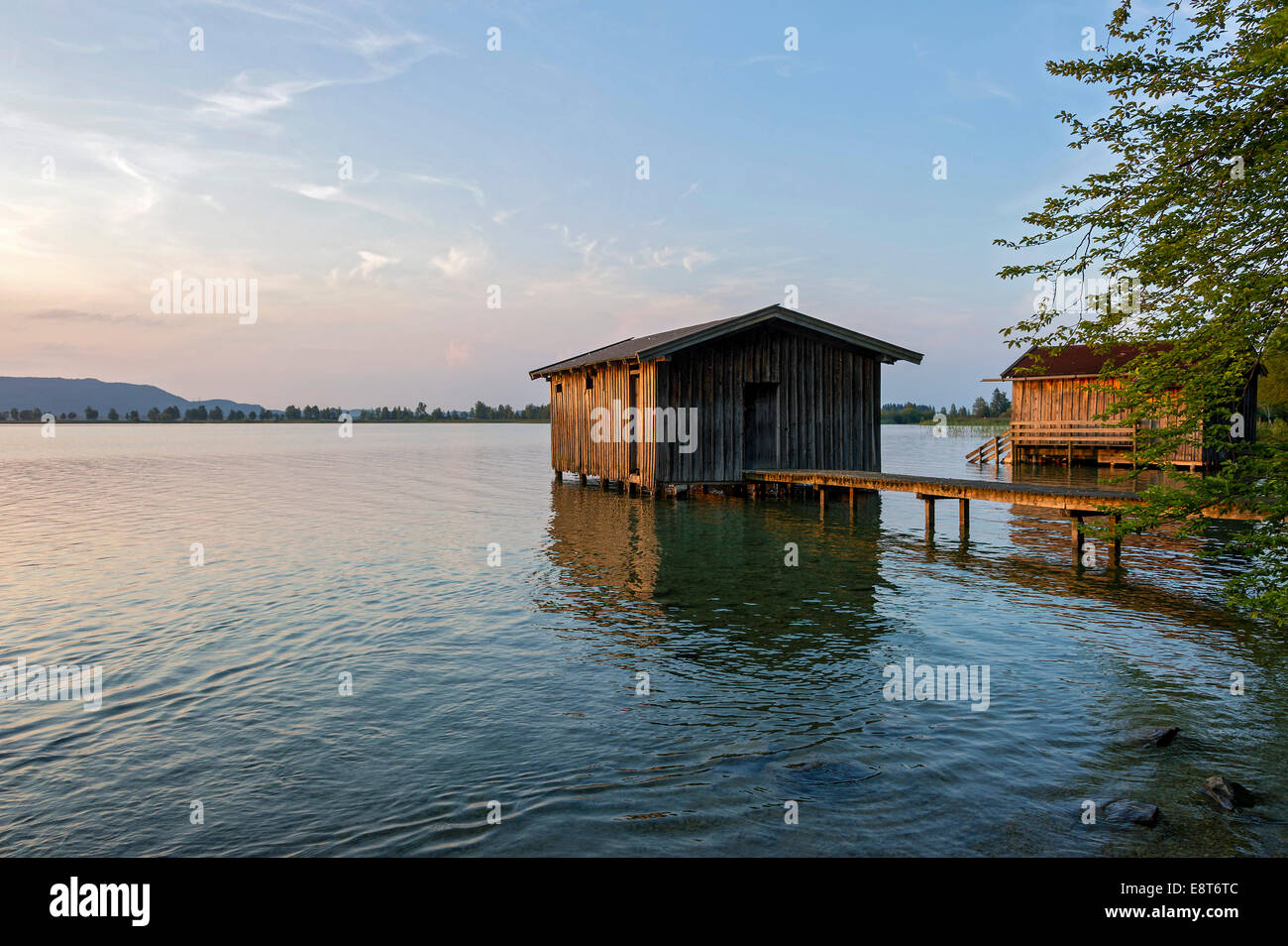 Boathouses on Lake Kochel in the evening light, Kochel am See, Upper Bavaria, Bavaria, Germany ...