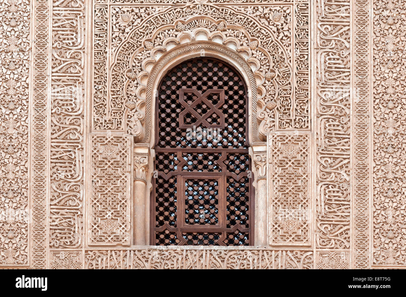 Ornate Moorish reliefs decorating the wall and the window arch in the ...
