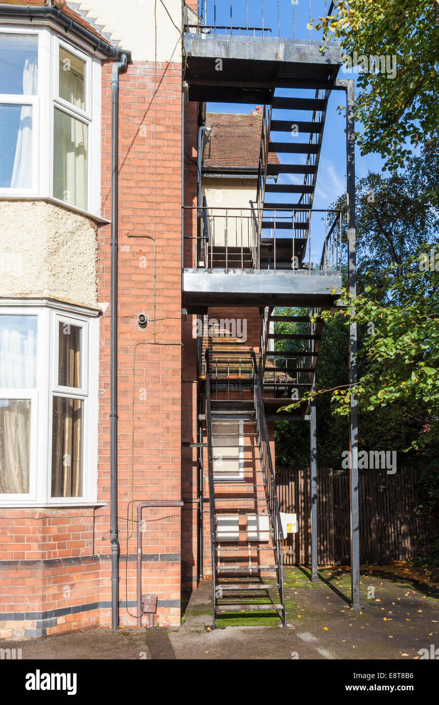 A fire escape on the side of a building containing residential flats ...