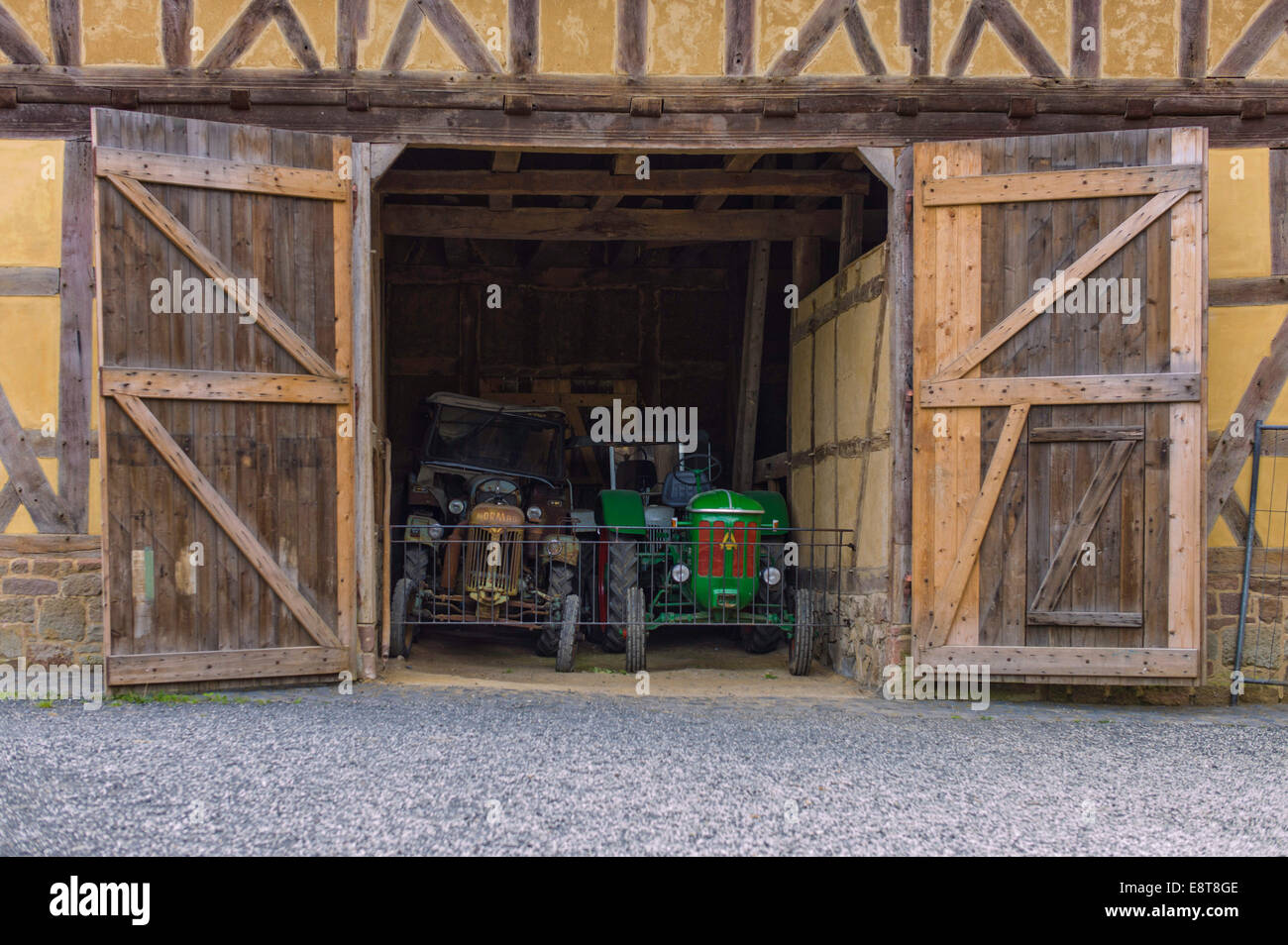 Half-timbered house with barn and historic tractors, Hessenpark open ...