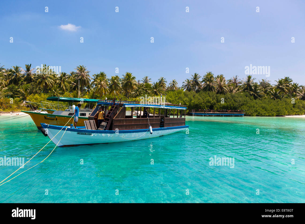 Boat in front of a Maldives island, Embudu, North Malé Atoll, Maldives ...