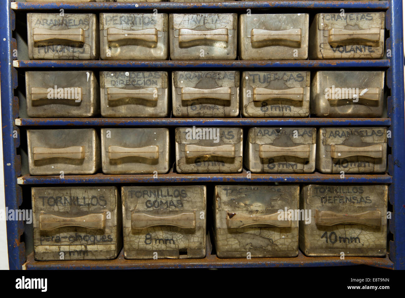 Screws in a hanging plastic box. Very old and dirty drawers box Stock ...