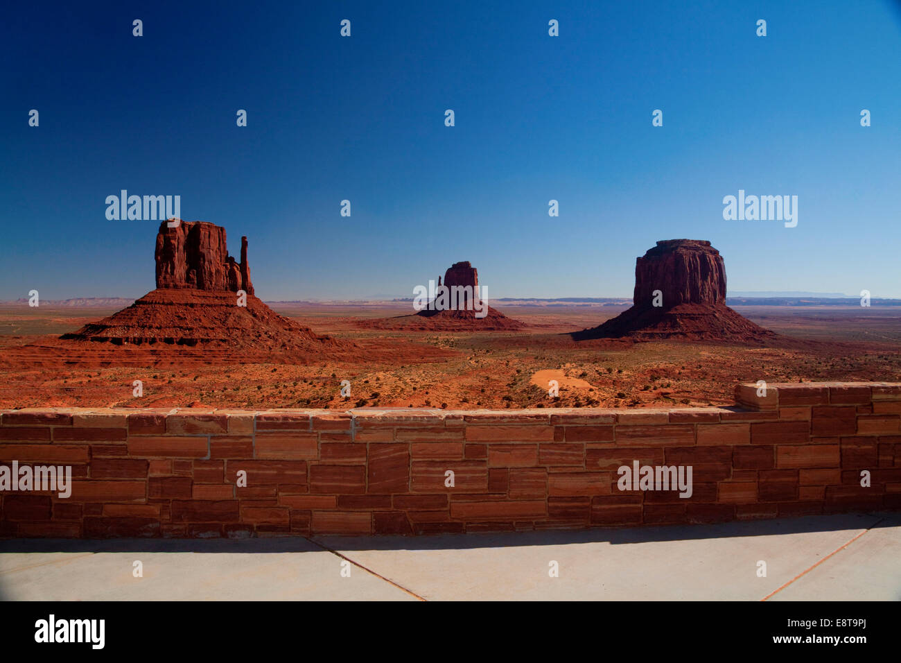 Butte rock formations in desert landscape, Monument Valley Tribal Park ...