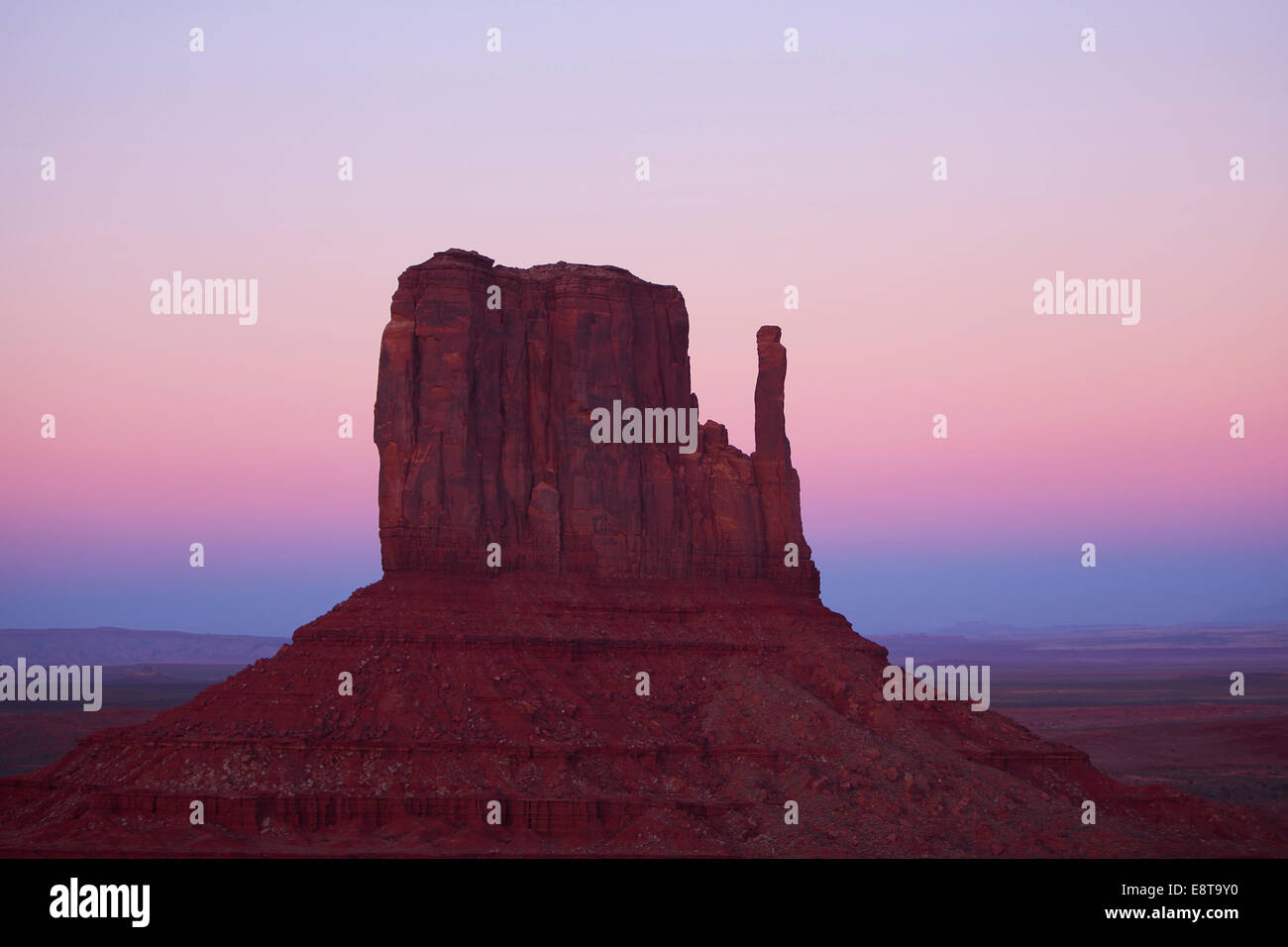 Butte rock formation in desert landscape, Monument Valley Tribal Park ...