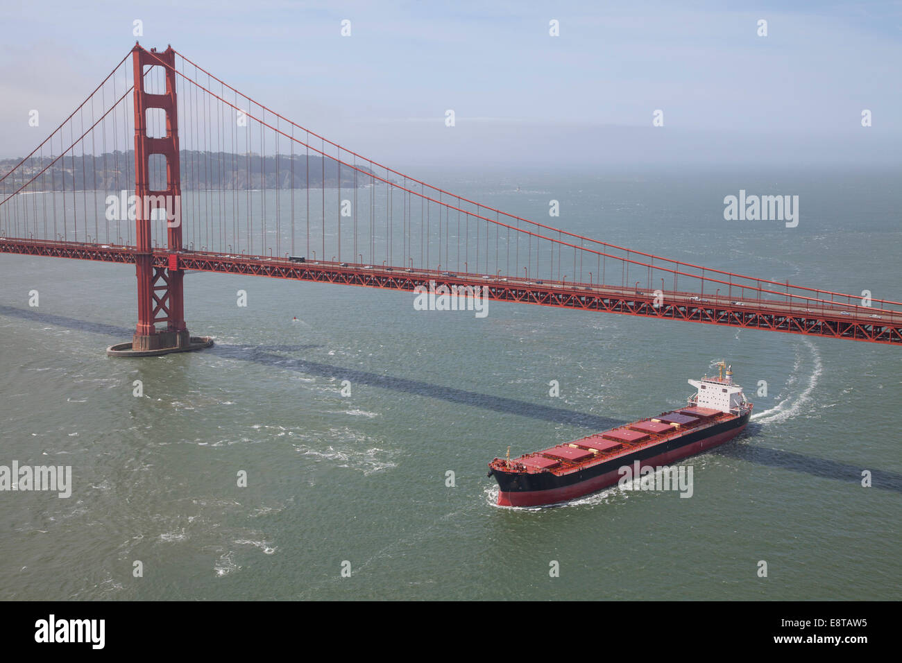 Aerial view of container ship under Golden Gate Bridge, San Francisco ...