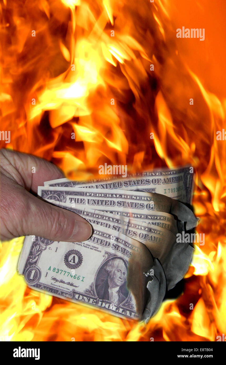 Burning money dollars burning currency burns Stock Photo - Alamy
