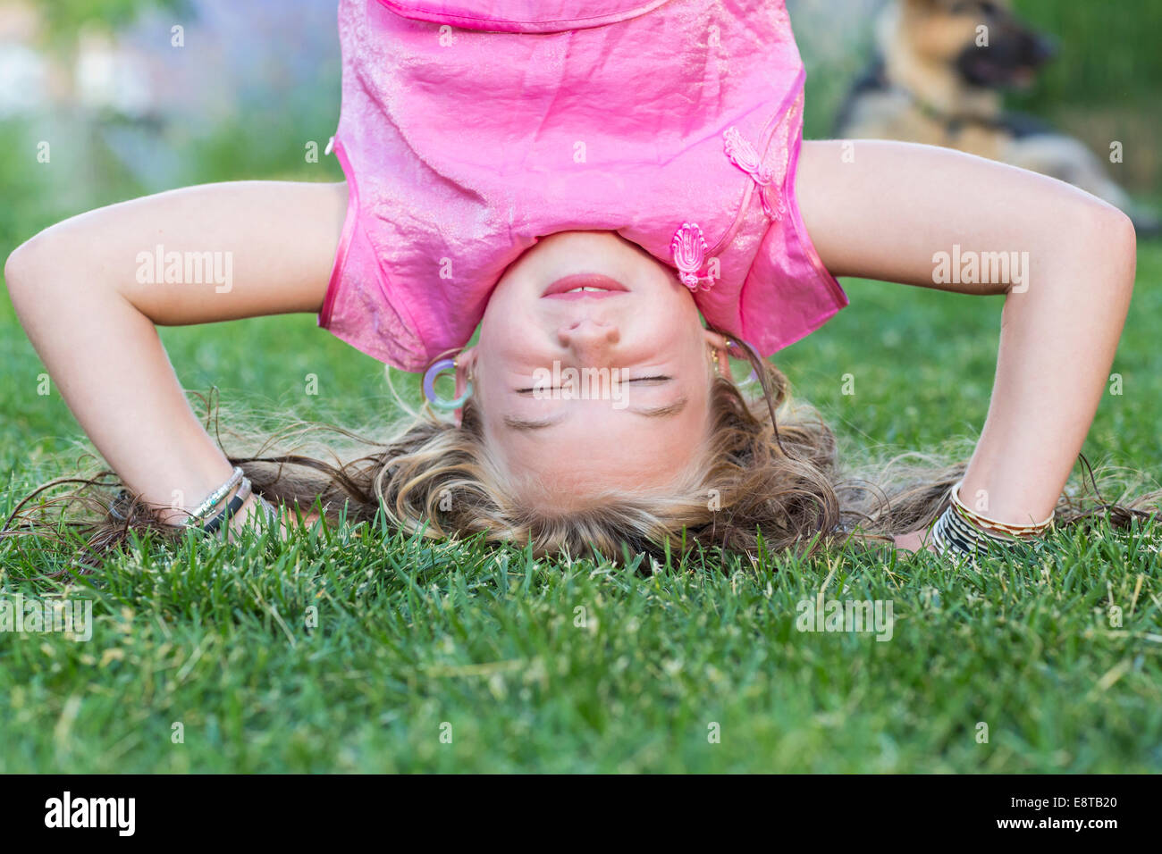Child doing headstand hi-res stock photography and images - Alamy