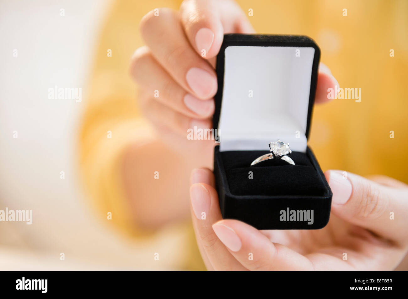 Holding Wedding Ring In Box