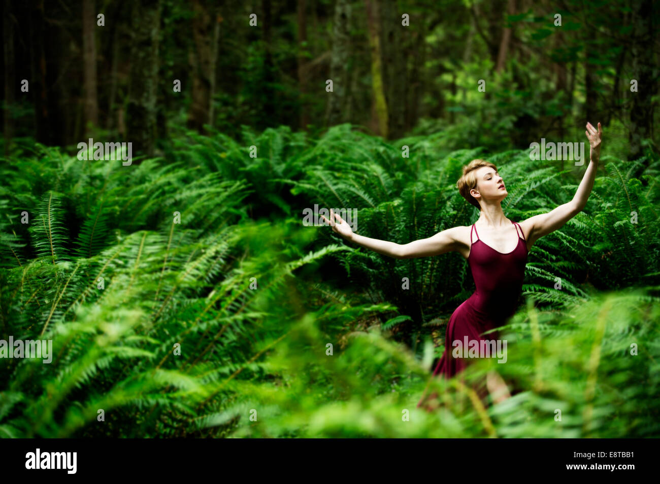 Caucasian woman dancing in forest Stock Photo - Alamy