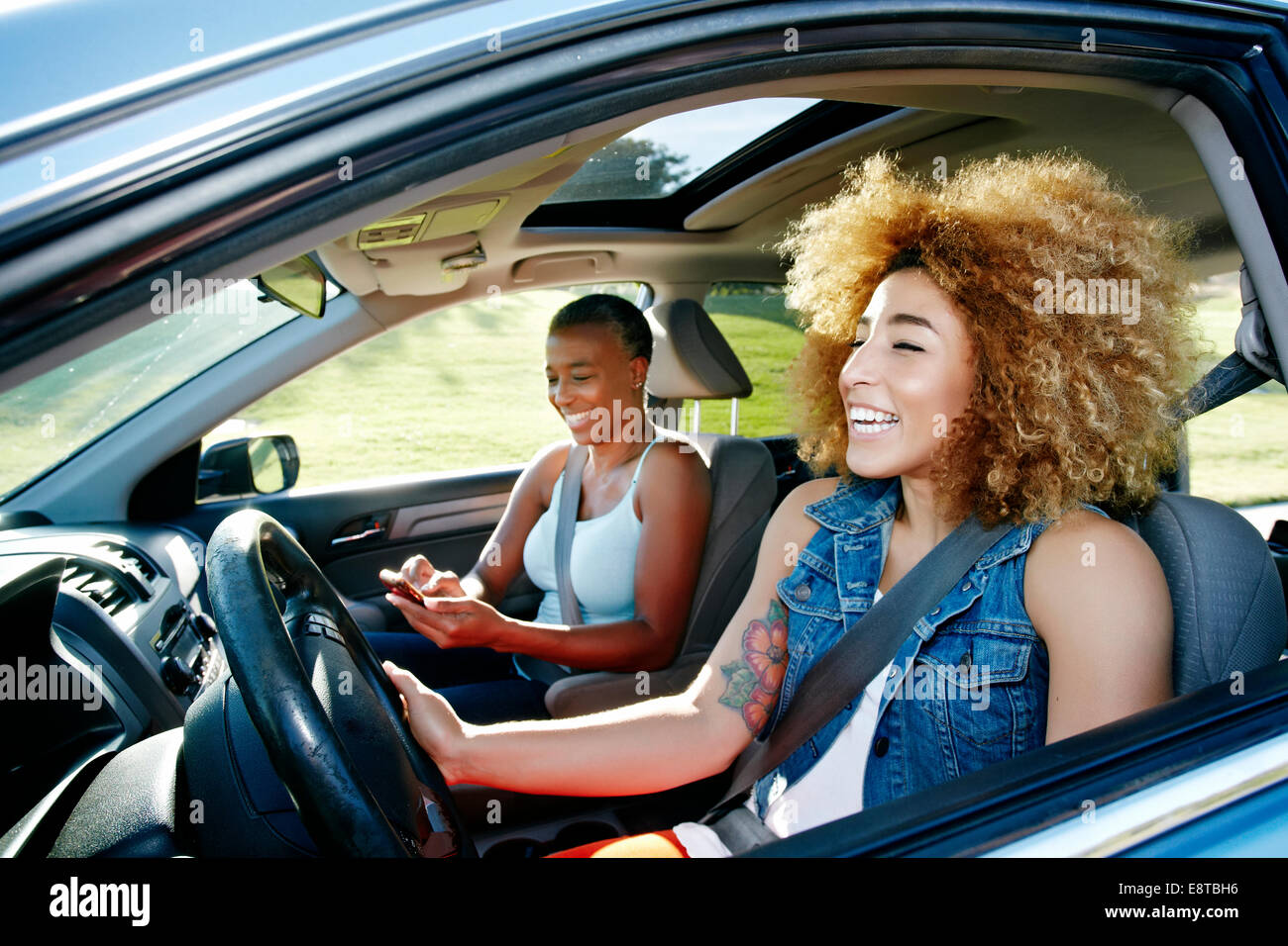 Daughter driving mother in car Stock Photo - Alamy