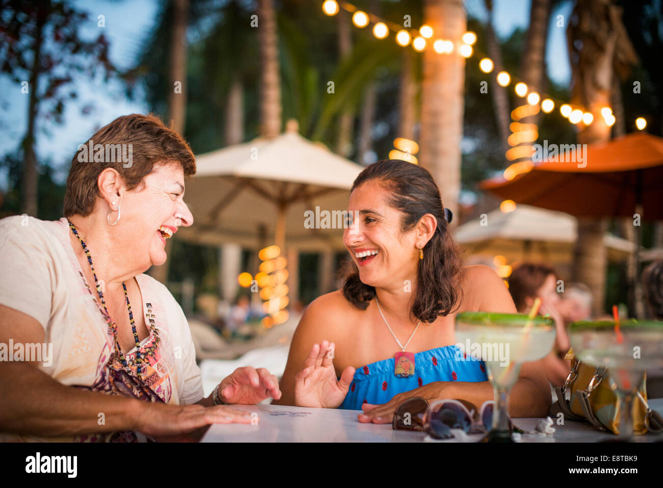 Women laughing restaurant table hi-res stock photography and images - Alamy