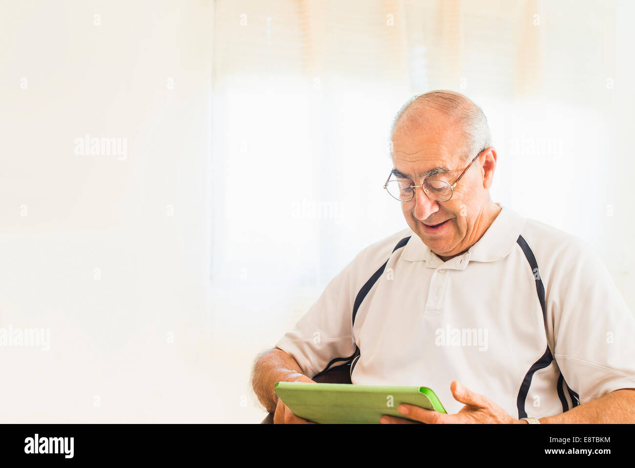 Happy older man using hi-res stock photography and images - Alamy