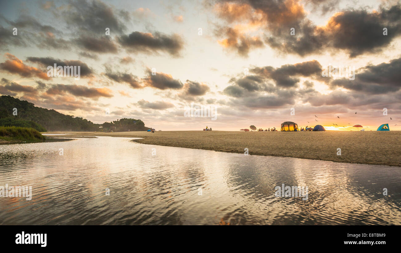 Clouds and still pool on beach Stock Photo - Alamy