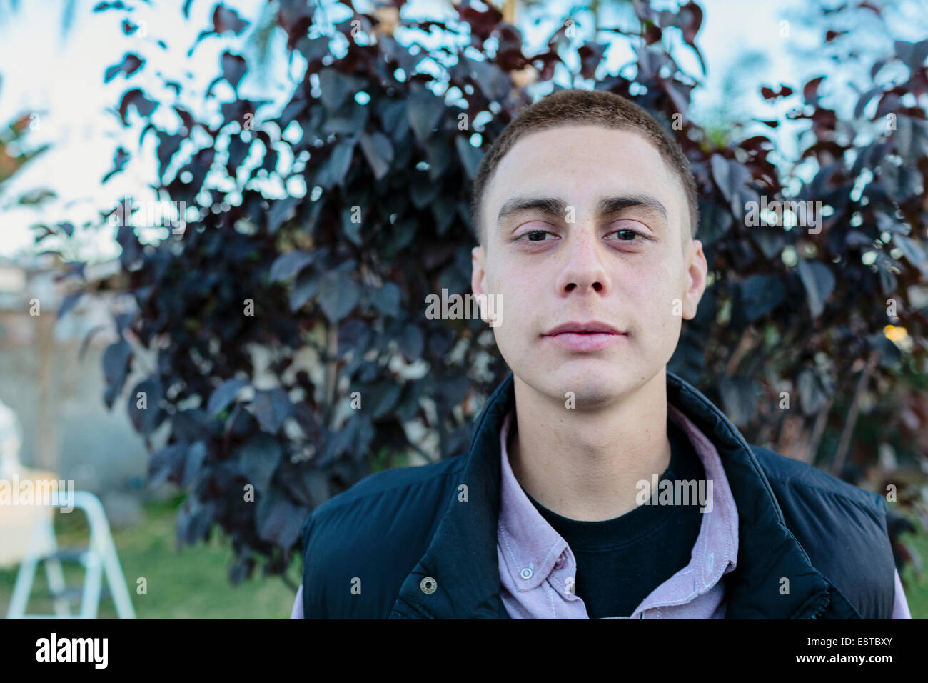 Hispanic man standing outdoors Stock Photo - Alamy
