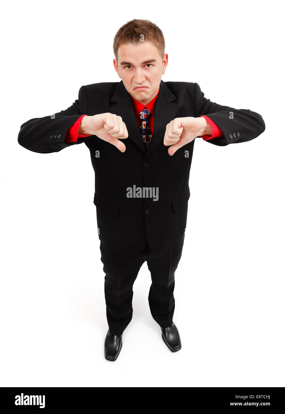 Young businessman showing disapproval with both hands and facial ...