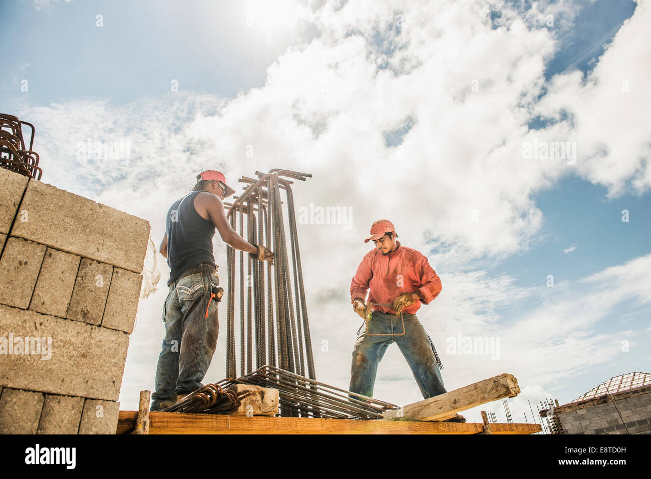 Hispanic construction workers at construction site Stock Photo - Alamy