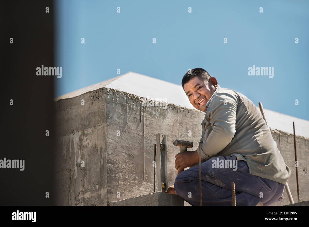 Hispanic construction worker at construction site Stock Photo - Alamy