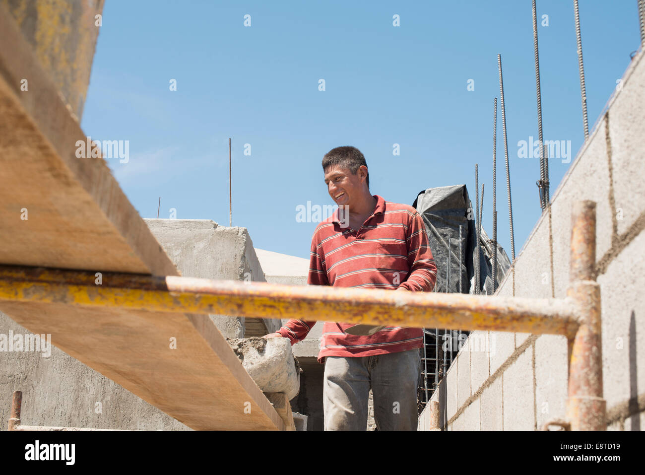 Hispanic construction worker at construction site Stock Photo - Alamy