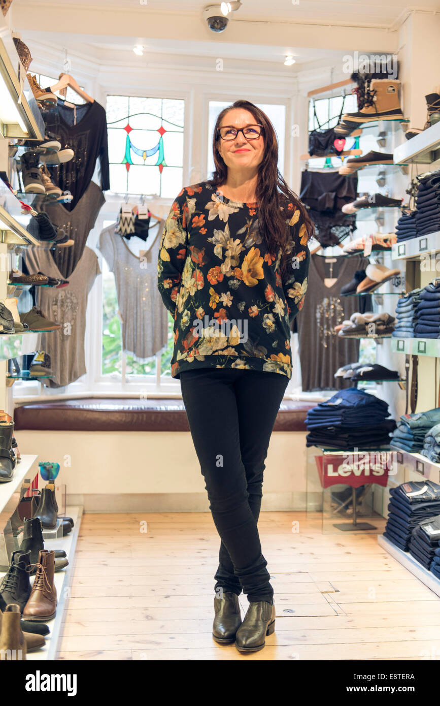 female, lady shopkeeper, saleswoman, in her clothes shot in Brighton ...