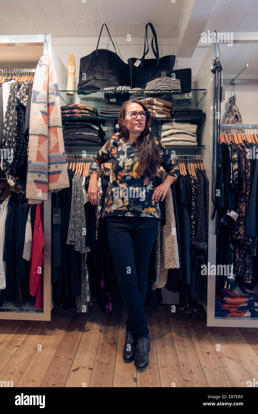 female, lady shopkeeper, saleswoman, in her clothes shot in Brighton ...