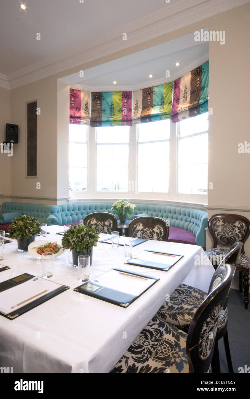 hotel meeting room with the table laid out for a business meeting with ...