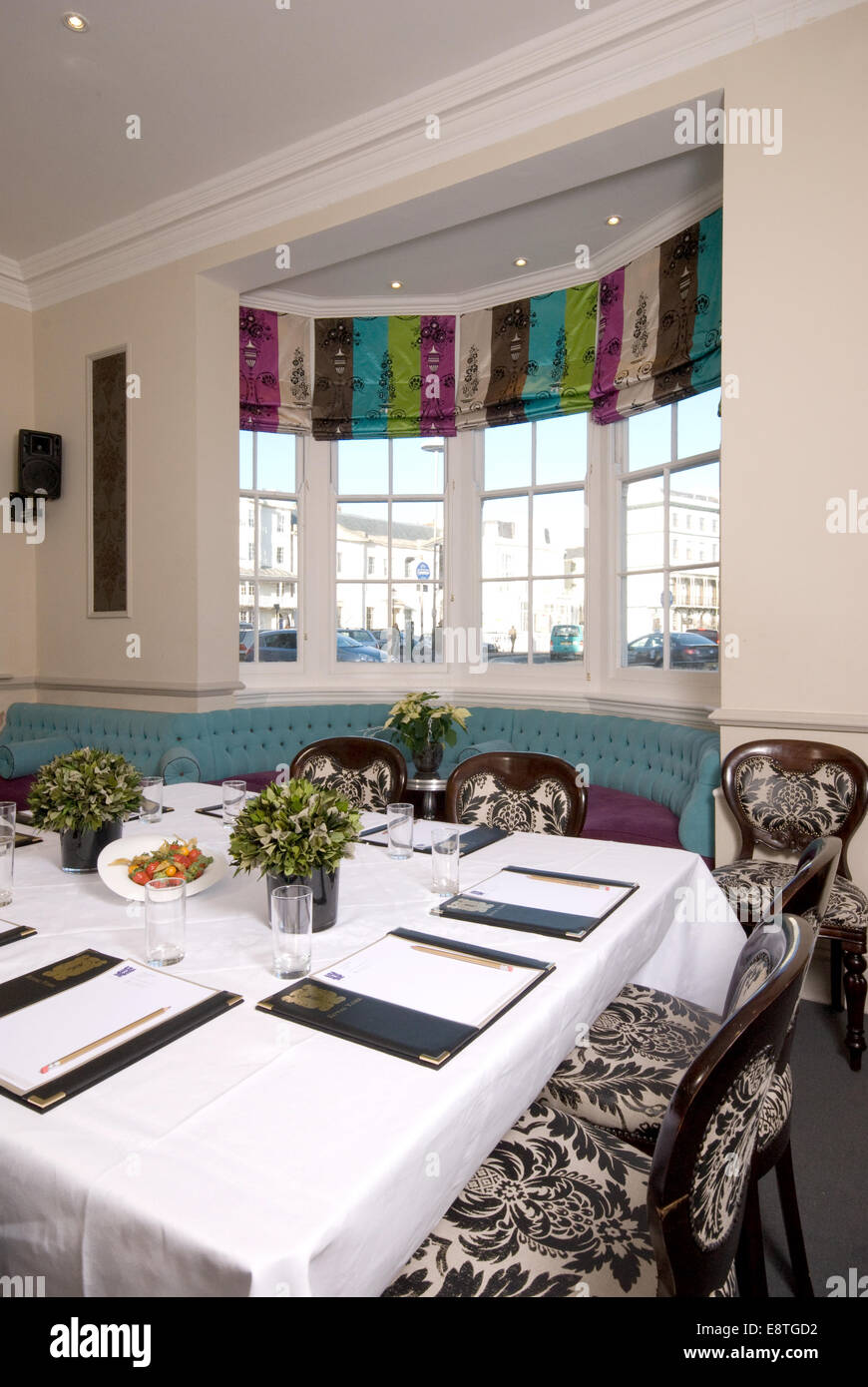 hotel meeting room with the table laid out for a business meeting with ...