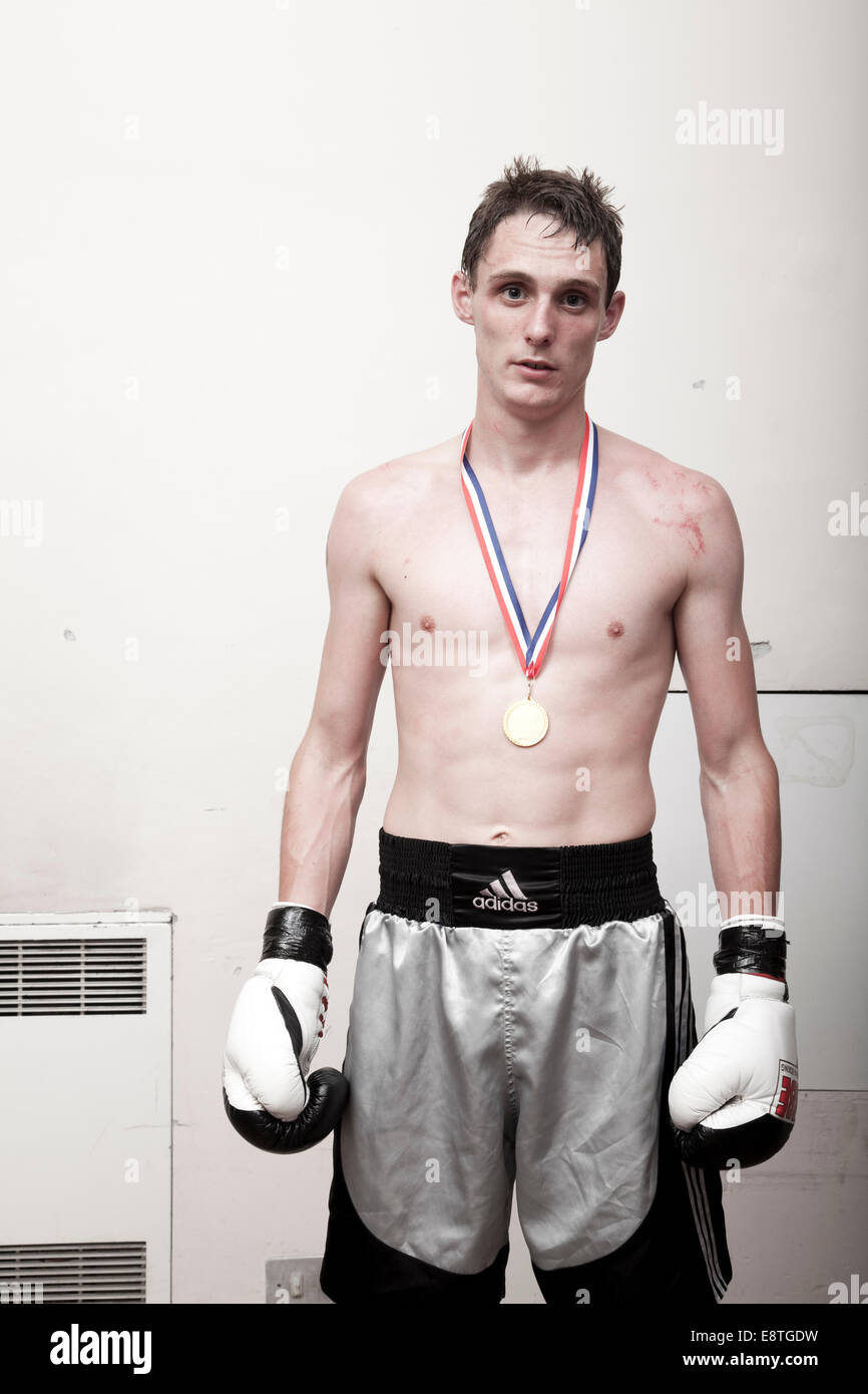 Boxers after a kickboxing boxing match, back stage, looking all tired ...