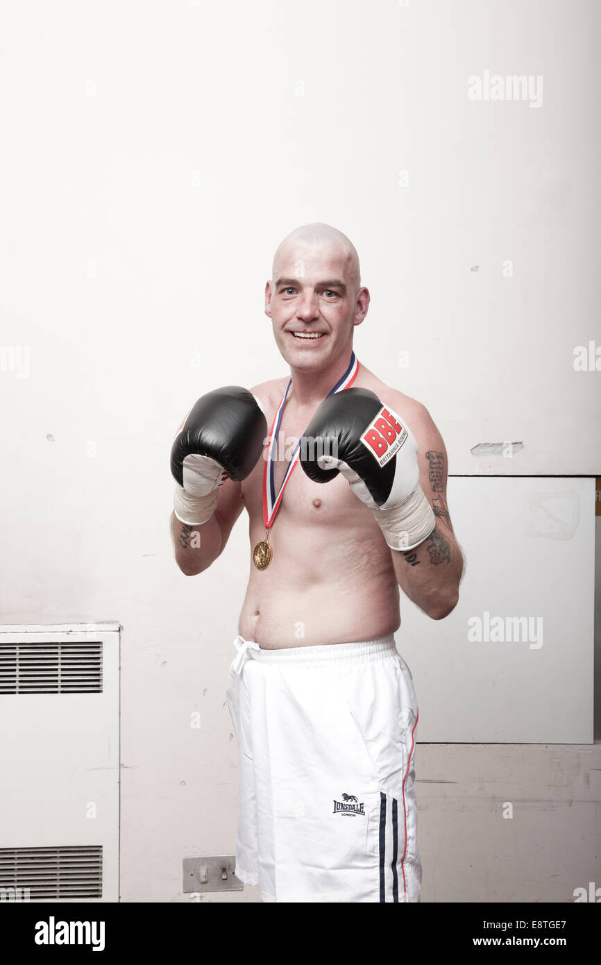Boxers after a kickboxing boxing match, back stage, looking all tired ...
