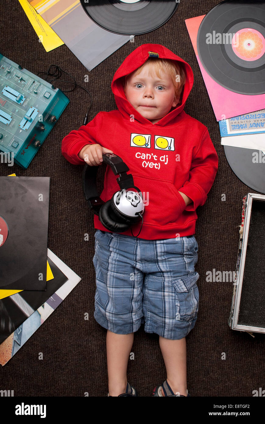 Child on comedy background shot in a studio wearing cool clothing, cool ...