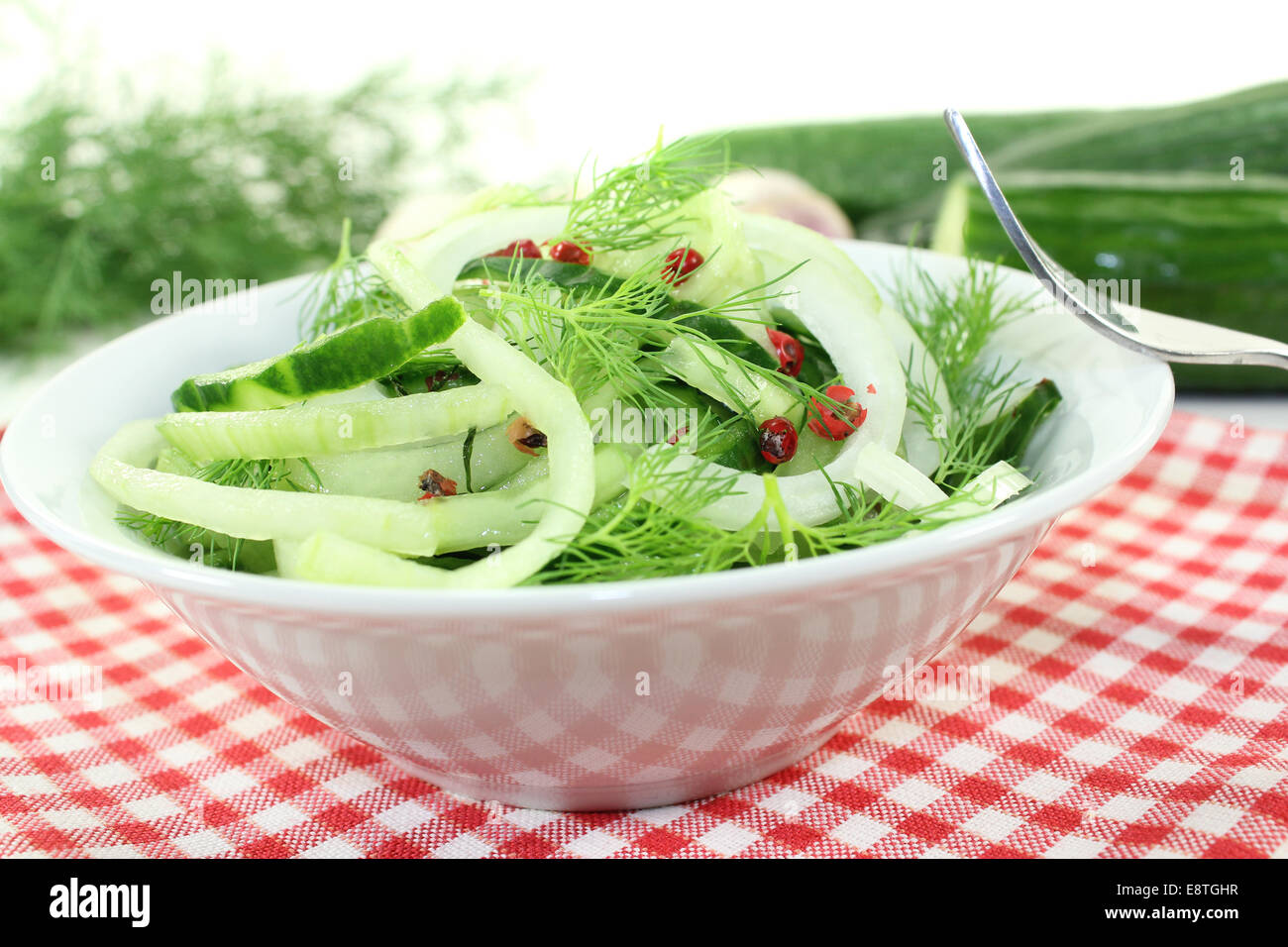 Spaghetti cucumber with red pepper and dill on bright background Stock ...