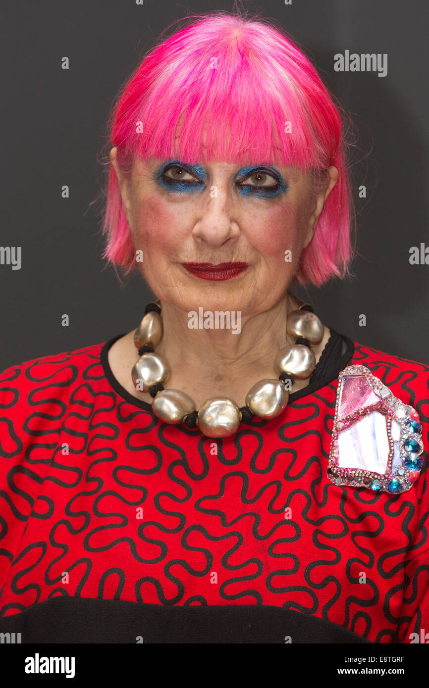 Dame Zandra Rhodes poses in front of the portrait of Catrina Hooghsaet ...